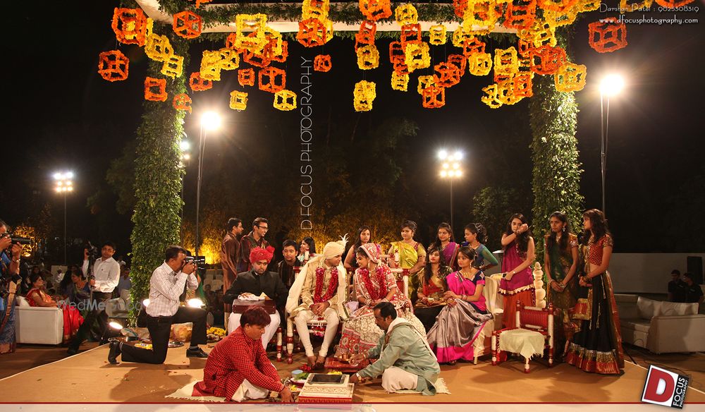 Photo of Modern Mandap Decor with Hanging Genda Phool Cubes