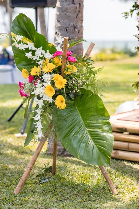 Photo of Mehendi jhoola seating decorated with bougainvilleas.