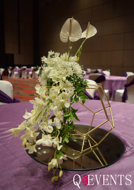 Photo of Stunning sunflower themed table centerpieces with fruits in vases