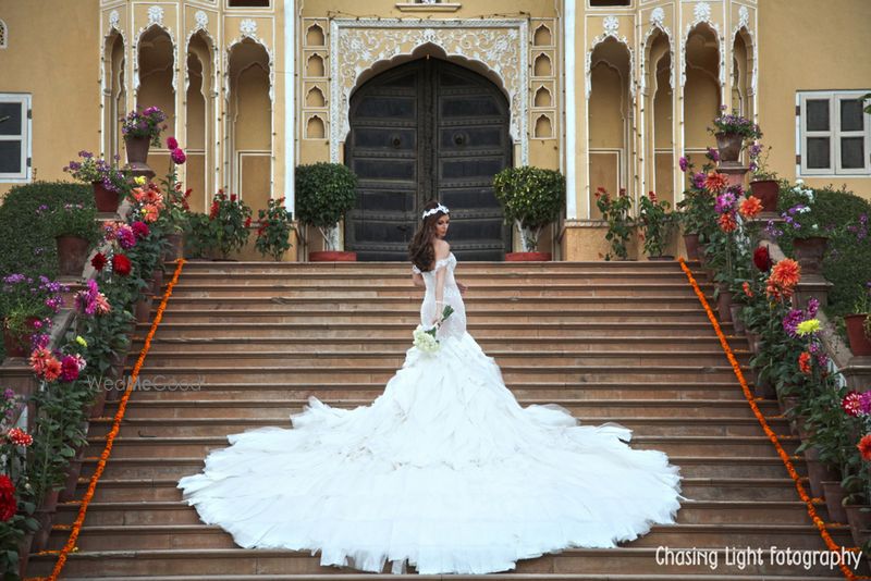 Photo of Ruffled White Wedding Gown with Dramatic Train