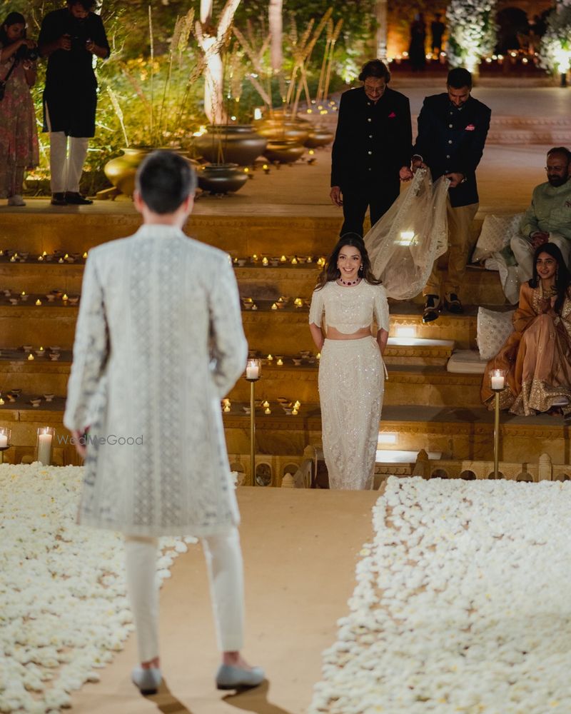 Photo of Beautiful bridal entry with bride in a ivory coloured co-ord ...
