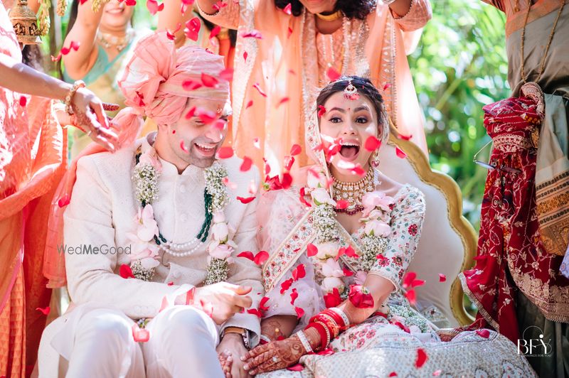 Photo of Cute couple shot during pheras of wedding