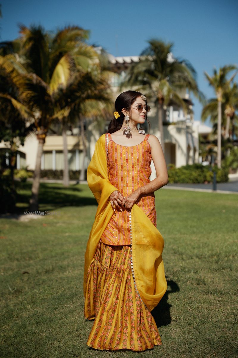 Photo of bride wearing a mustard sharara for her haldi