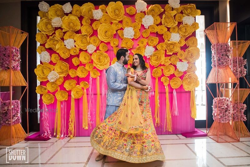 Photo of Mehendi decor ideas with paper flower backdrop