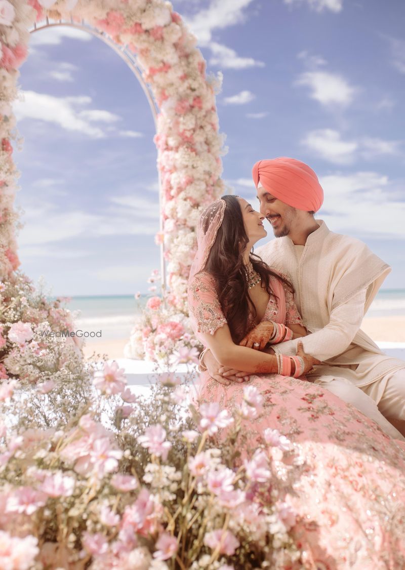 Photo of Adorable couple shot at a day wedding with groom in a white ...