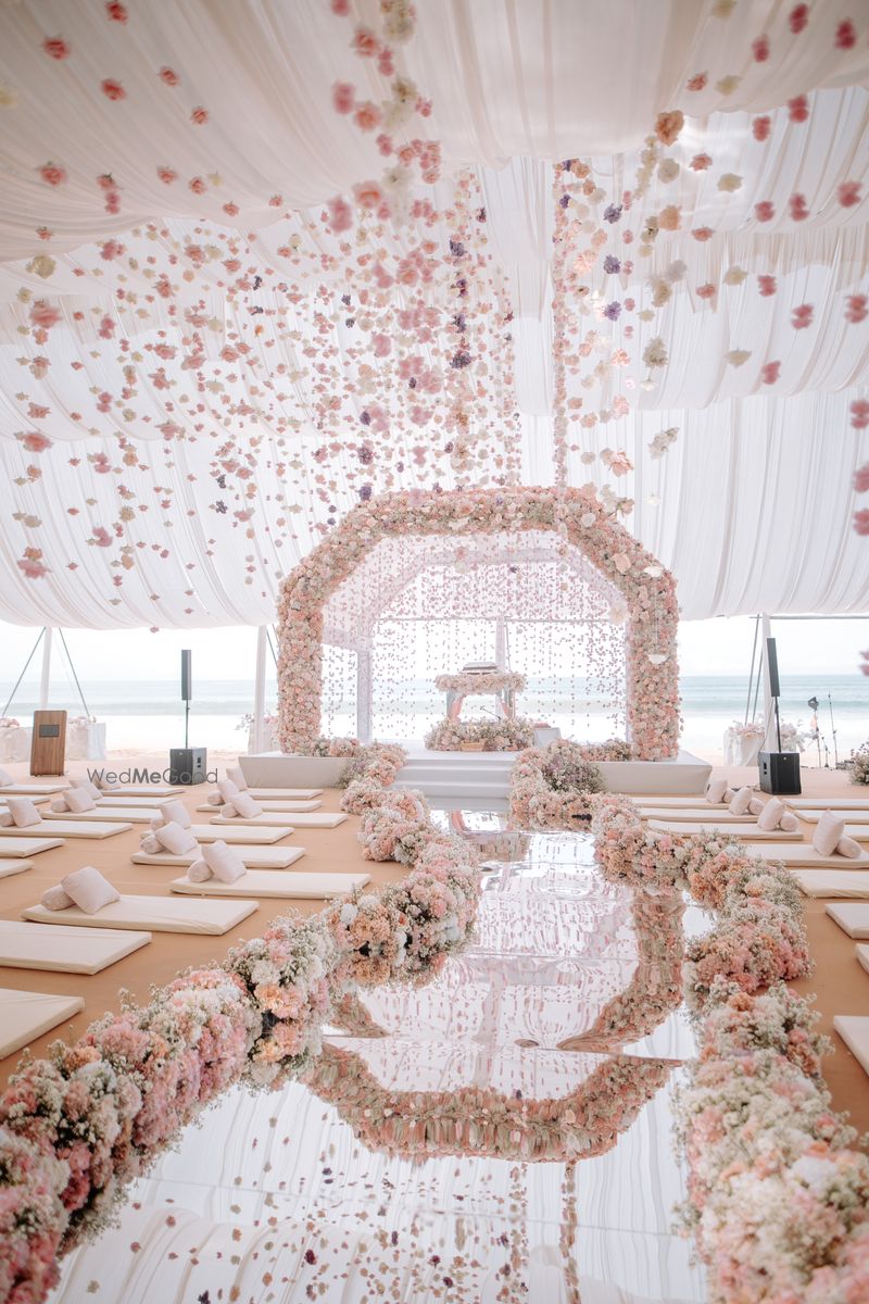 Photo of Gorgeous floral mandap in pink and white with a mirror aisle ...