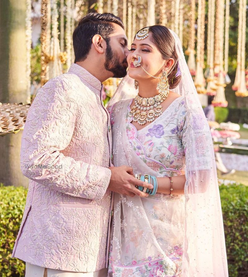 Photo of Bride in a unique pastel wedding lehenga