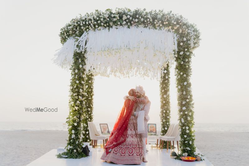 Photo of Gorgeous just married shot of the bride and groom hugging ...