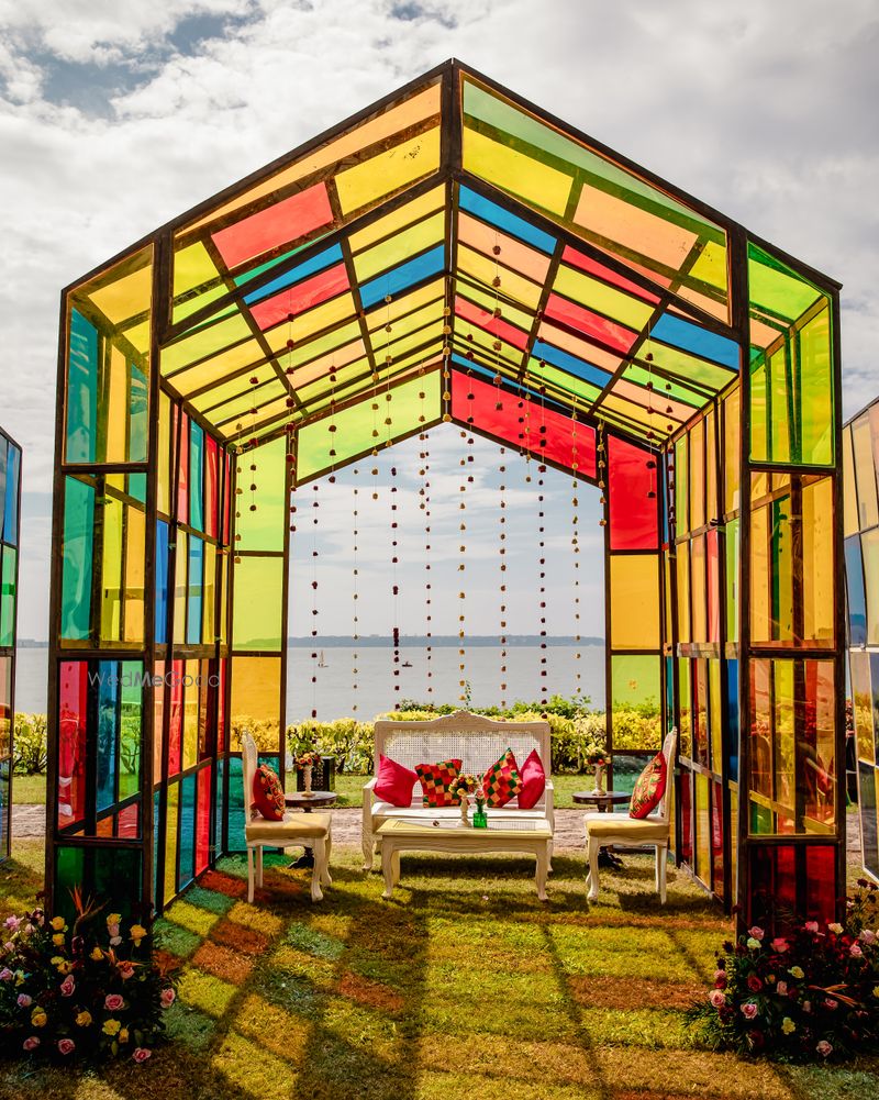 Photo of Fun and colorful seating with decor for Mehendi function