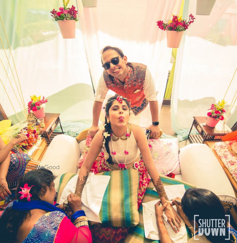Photo of Bride putting mehendi