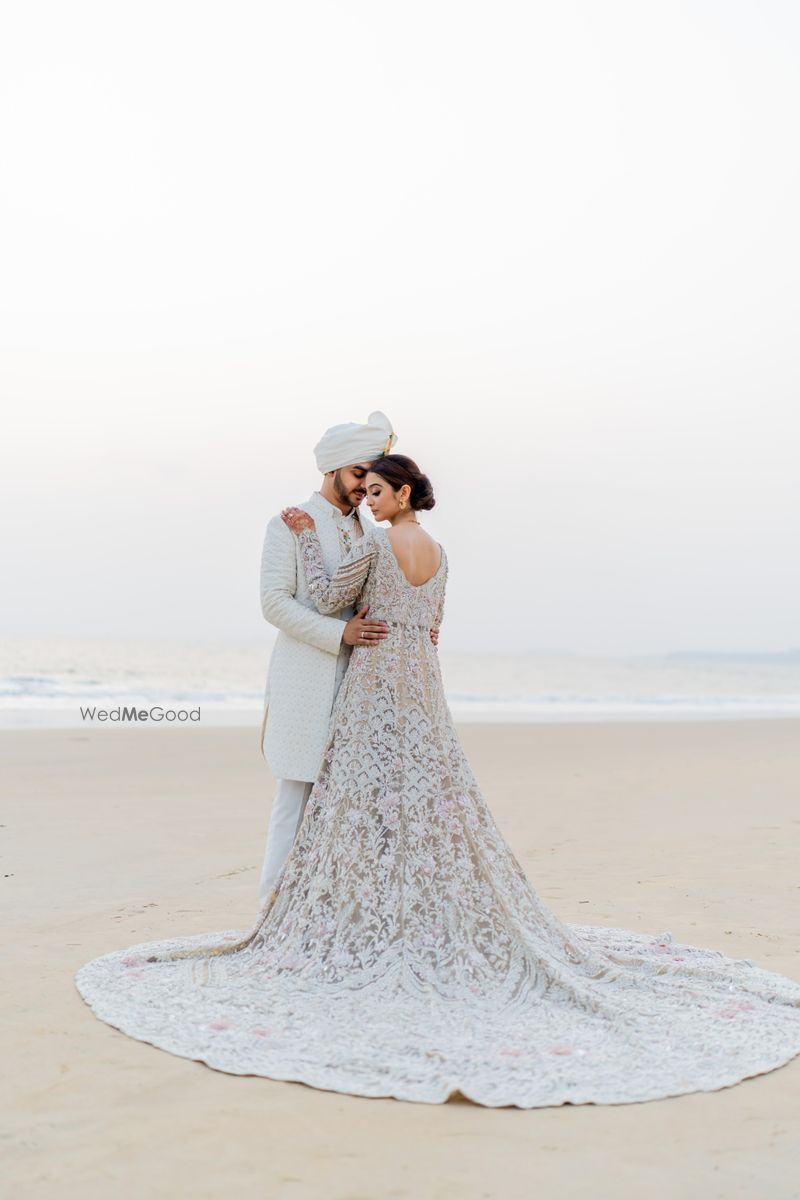 Photo of all white couple wedding day look