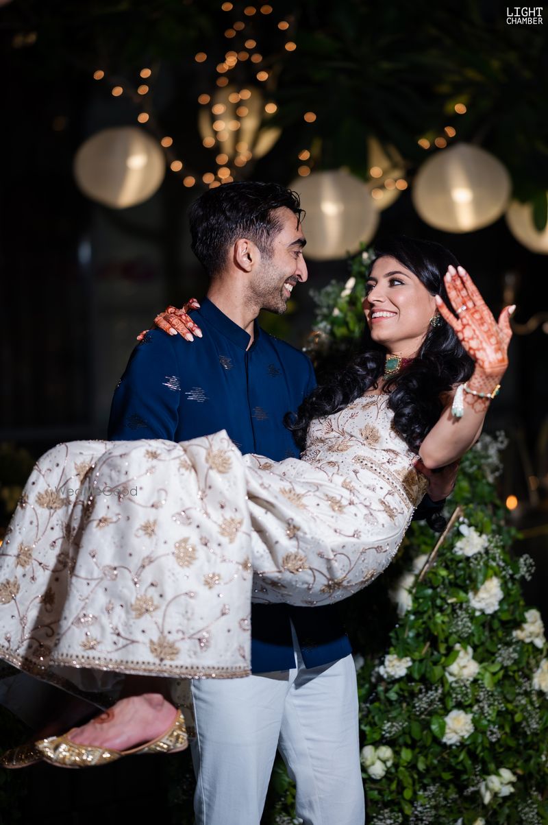 Photo of Couple posing with a ring on their engagement night
