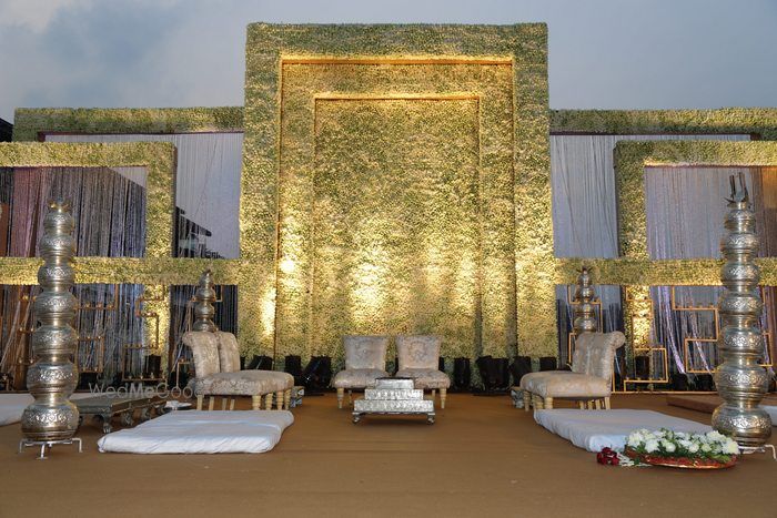 Photo of Stage decor in white with floral wall