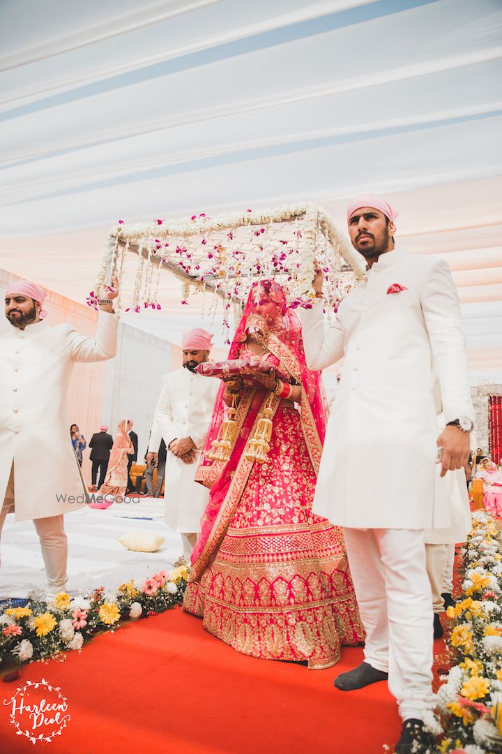Photo of Bride entering with veil and matching brides men