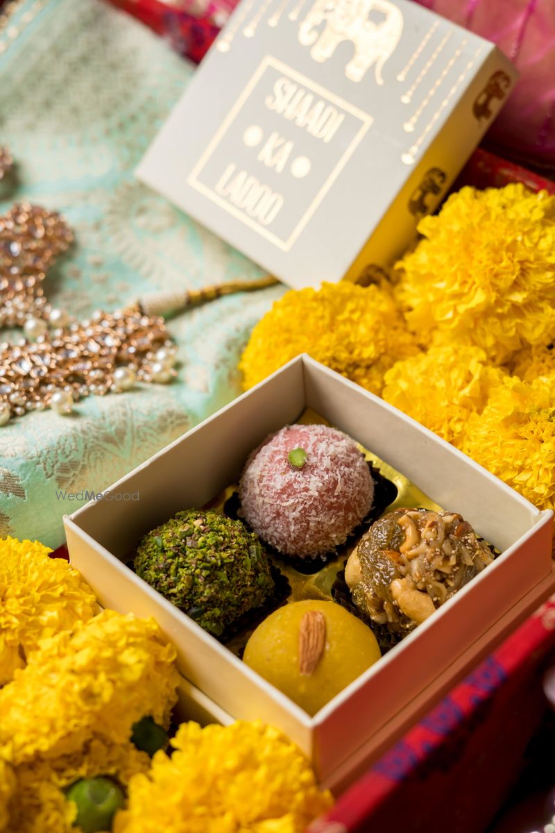 Photo of Cute ladoo boxes with unique mithai as part of bridal ...