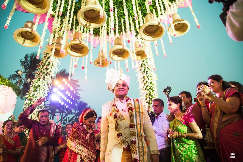 Photo of Unique mandap decor with hanging temple bells