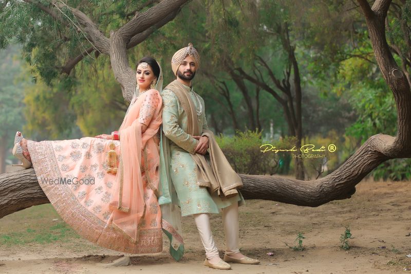 Photo of A sikh couple poses after their wedding