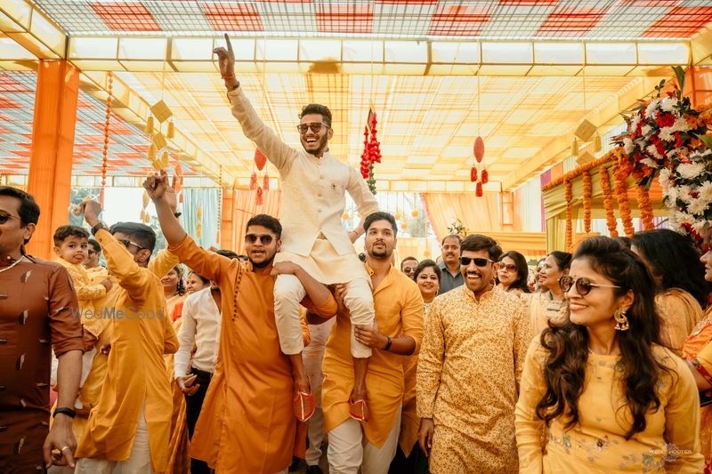 Photo of Groom entry with groomsmen