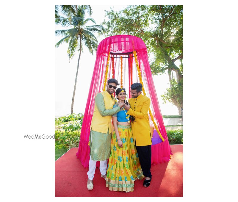 Photo of Bright pink and yellow mehendi decor mandap