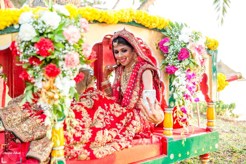 Photo of floral decorated palki bride entry