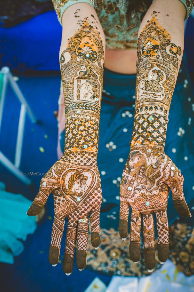 Photo of Full hand mehendi design.