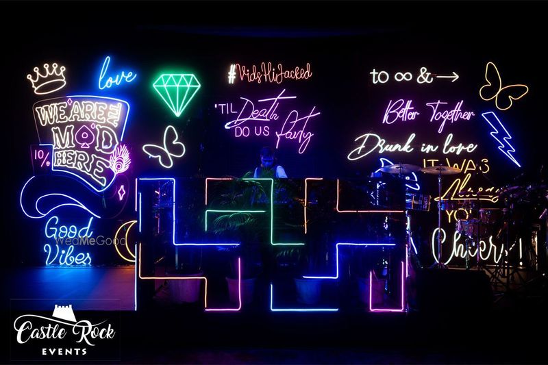 Photo of A backdrop decorated with neon signs.