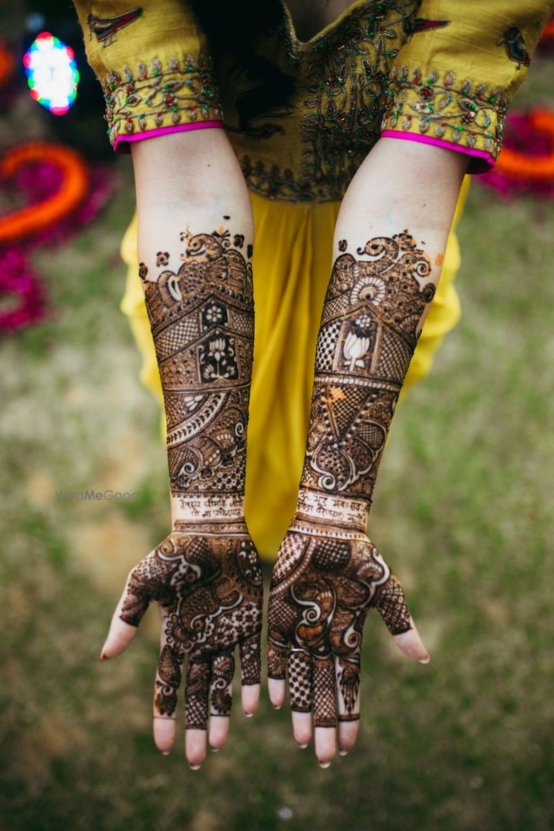 Photo of Unique bridal mehendi with text
