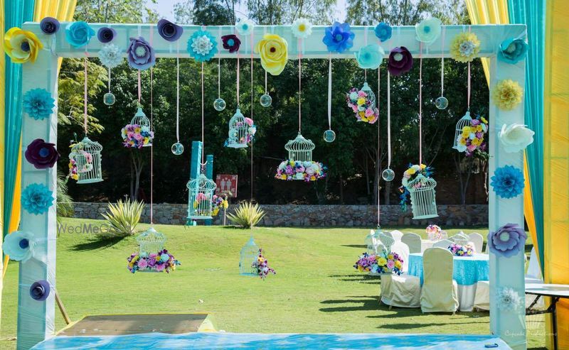 Photo of Light blue and yellow decor Photo Booth with birdcage