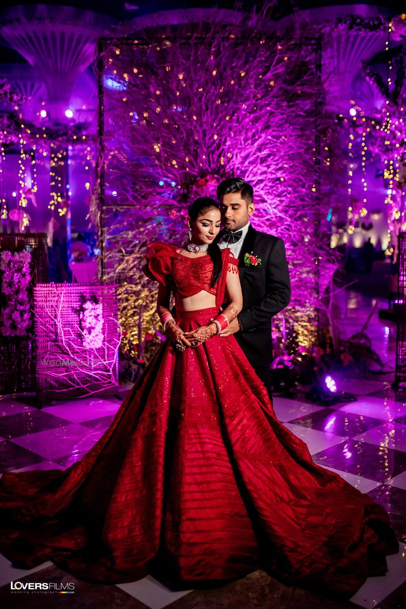 Photo of dramatic unique cocktail gown in red