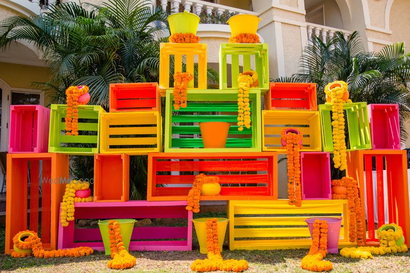 Photo of Photobooth created with a stack of handpainted wooden crates.