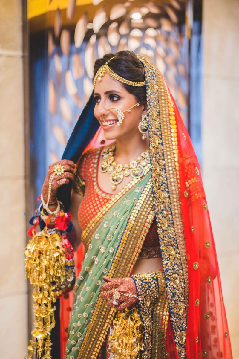 Photo of Red and blue bridal portrait