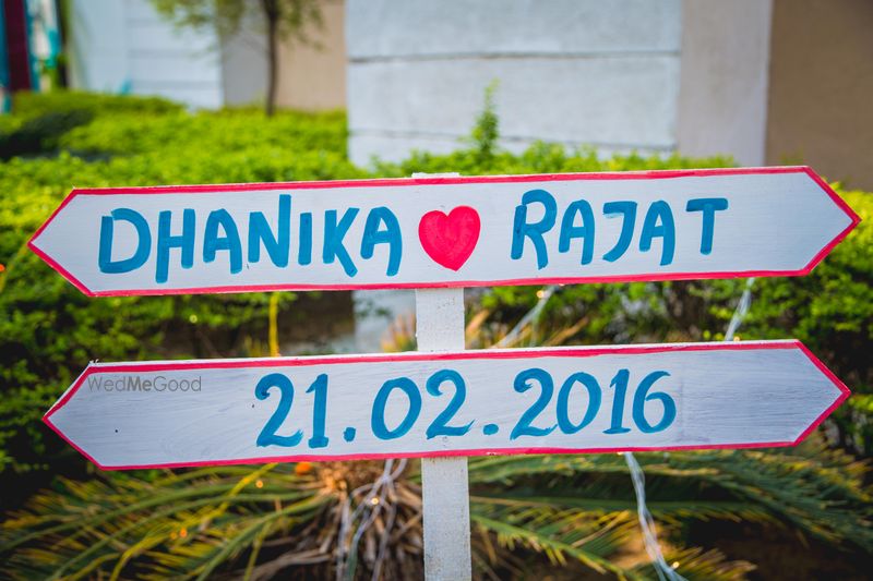 Photo of Wooden direction board with couple name and date