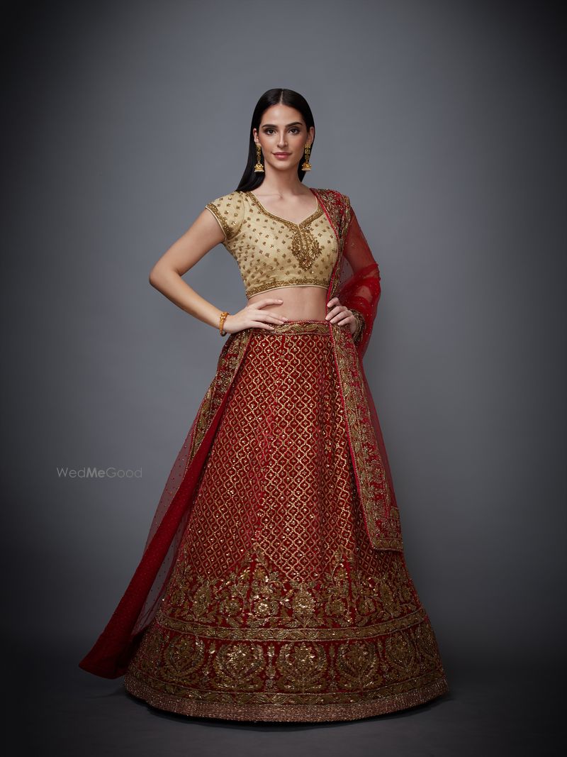 Red zardosi lehenga emsemble by Ritu Kumar