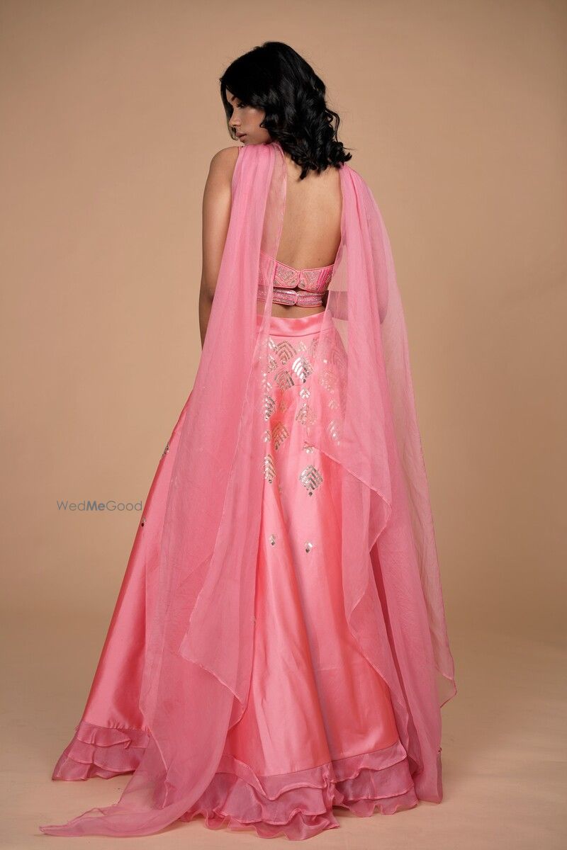 Light pink layered ruffle lehenga by Tamaraa By Tahani