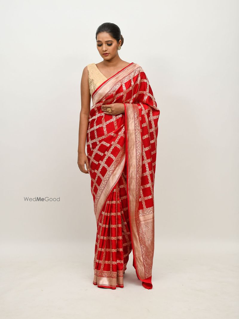 Red saree with gold zari checks by Designer